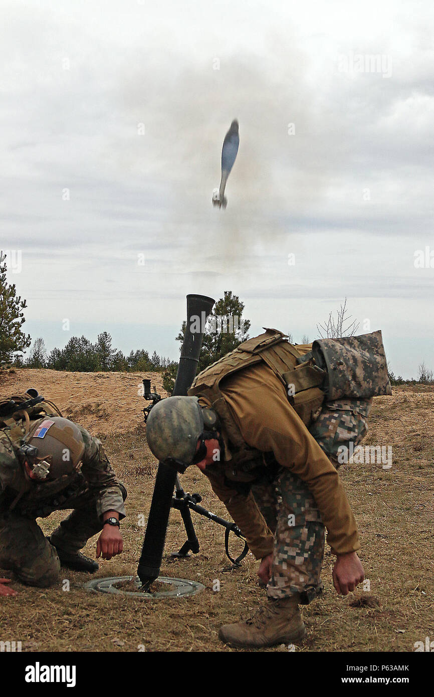 A Latvian special forces soldier and a Special Operations Command ...