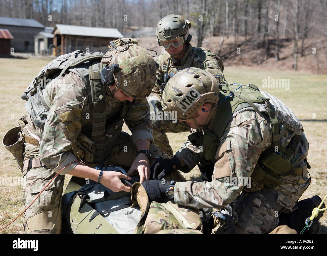 U.S. Soldiers prepare to hoist a mock casualty during the Rough Terrain ...