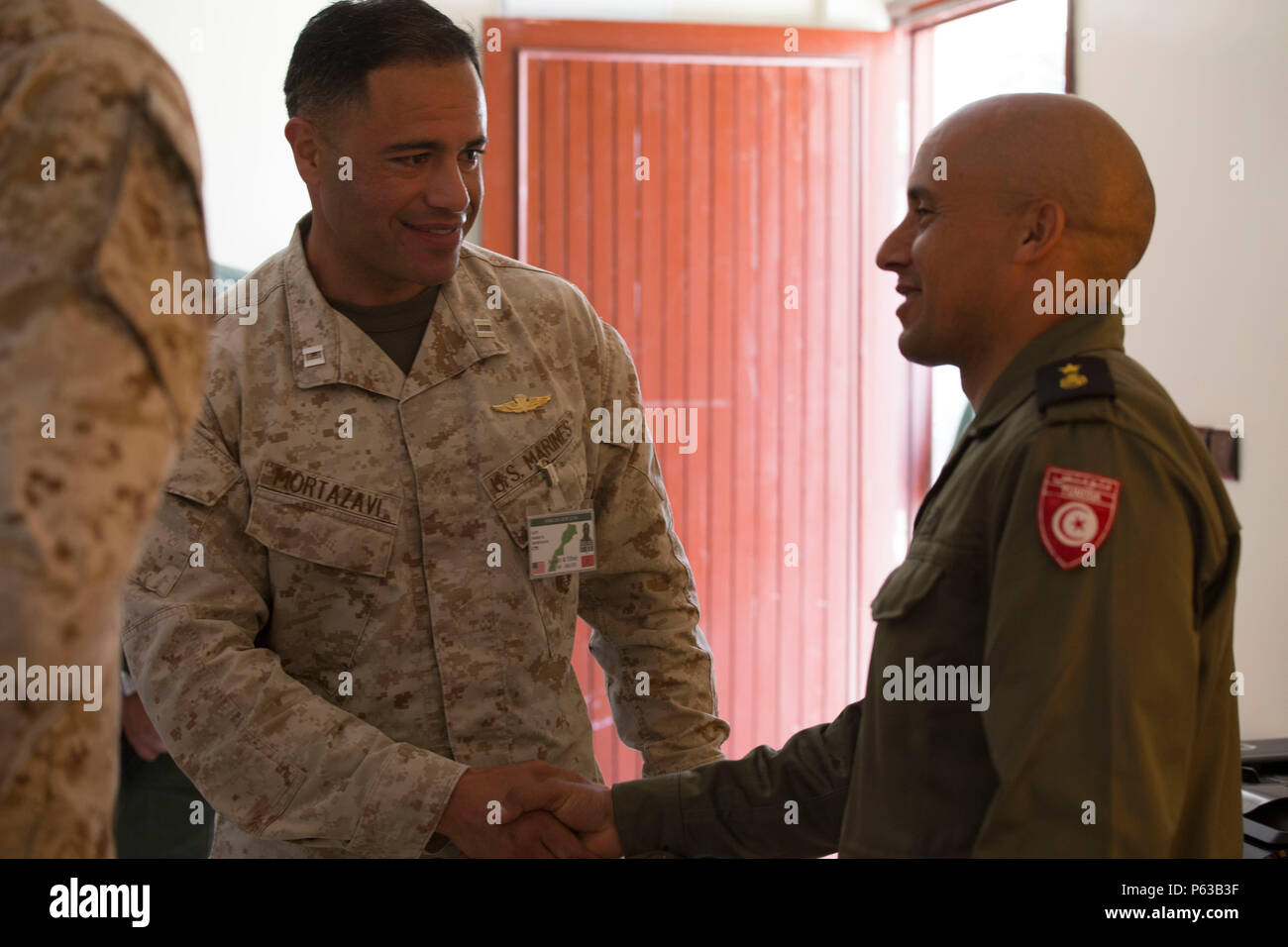 Marine Capt. Hamid Mortazavi (left), fire support officer with 4th Air ...