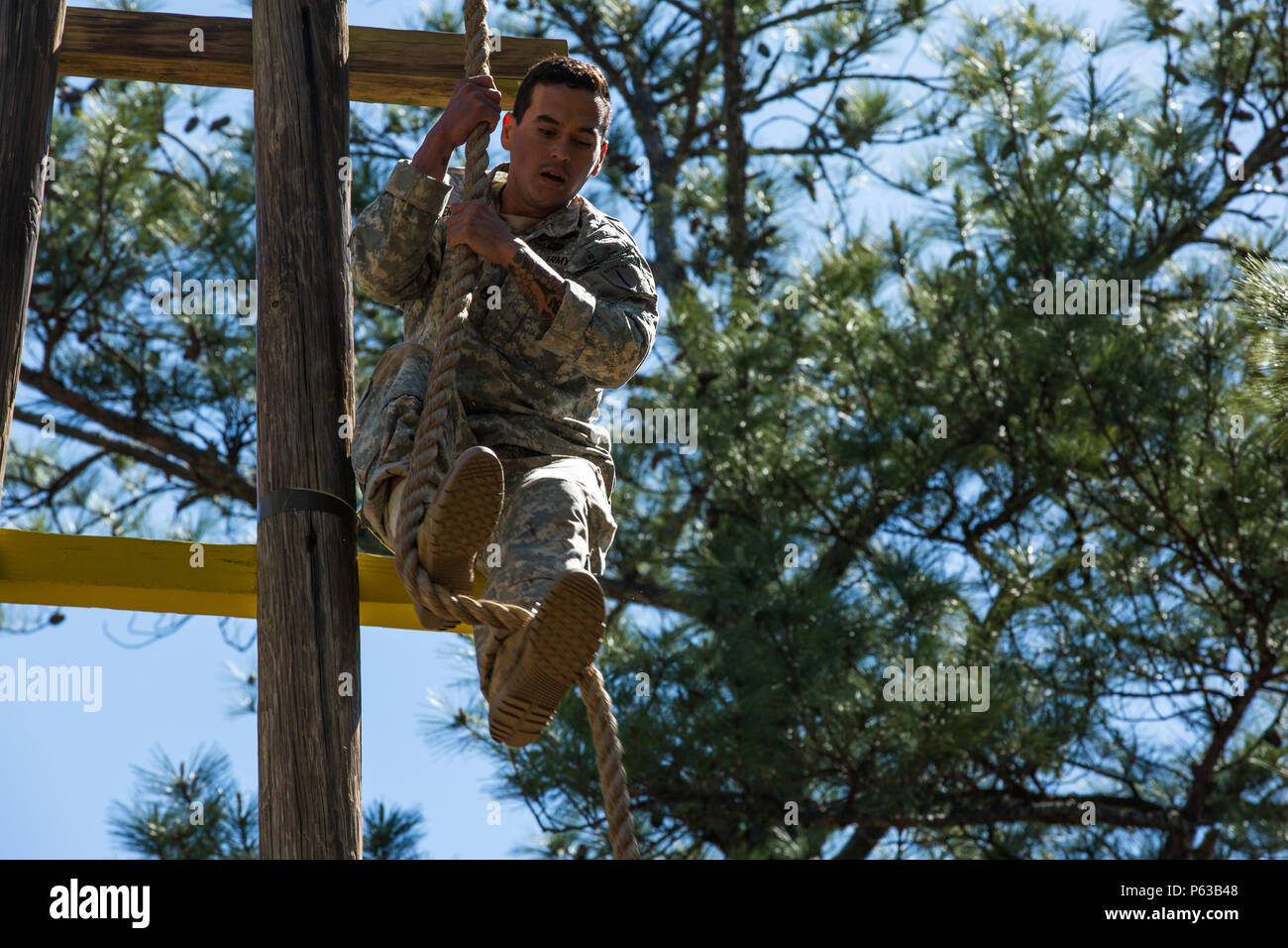 A U.S. Army Solider lowers himself down a rope at DARBY QUEEN obstacle ...