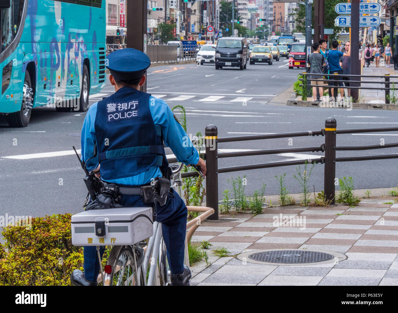Japanese Police officer on a bicycle in the streets of Tokyo - TOKYO ...