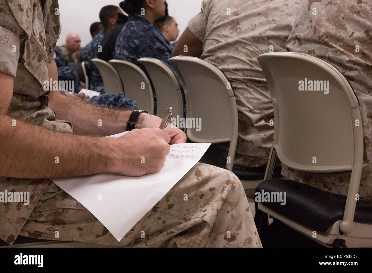 Students take notes during a Basic Brig Escort course aboard Marine ...