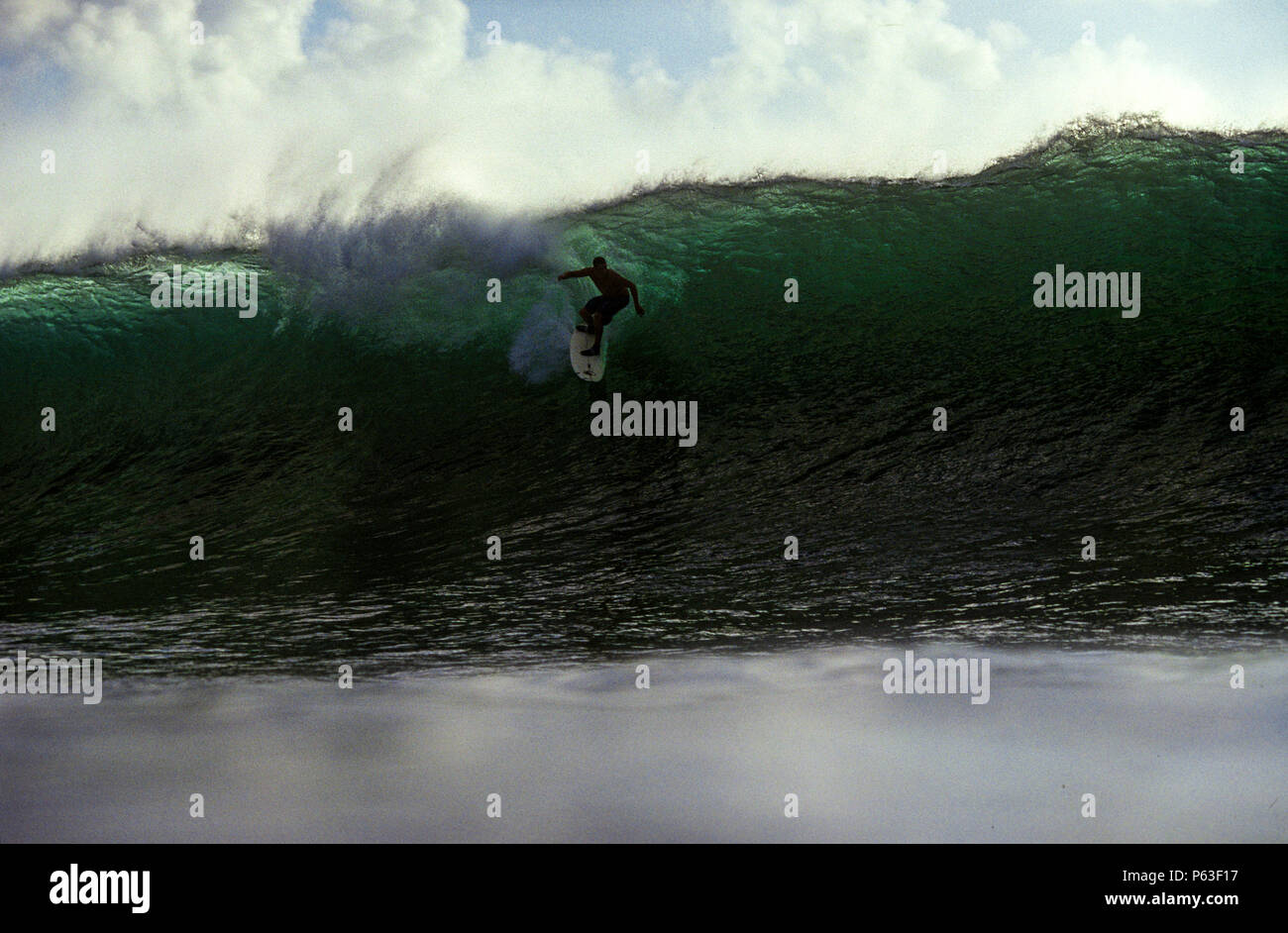 Surfing a big reef wave at Grajagan Bay, Java, Indonesia Stock Photo ...