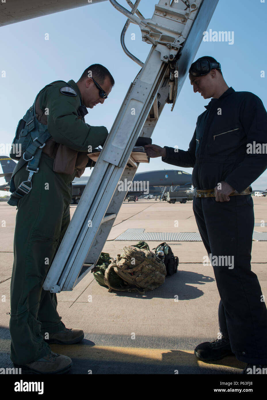 A 9th Bomb Squadron B-1B Lancer pilot, left, and Senior Airman Robert ...