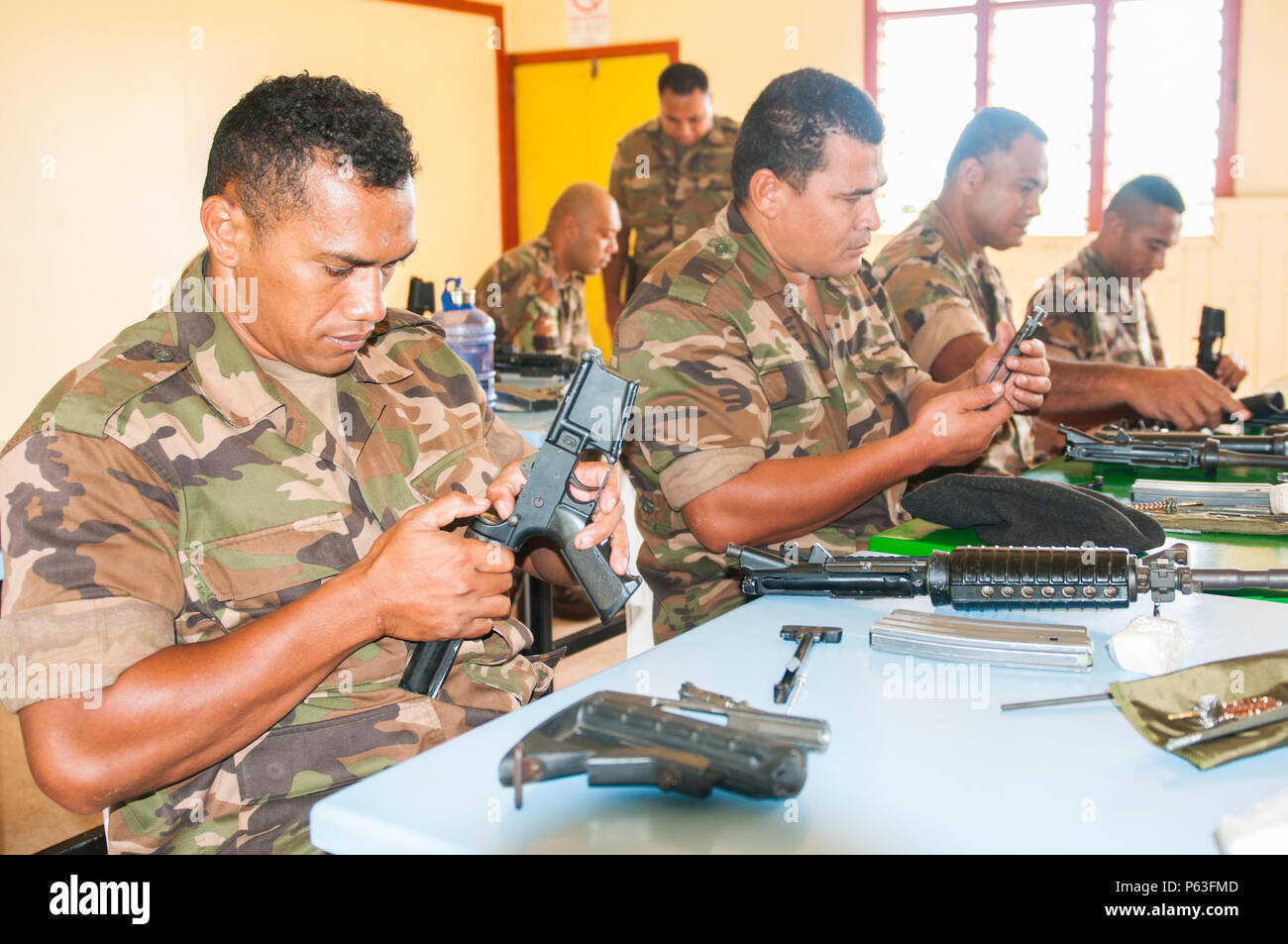 Members of His Majesty's Armed Forces of the Kingdom of Tonga clean ...
