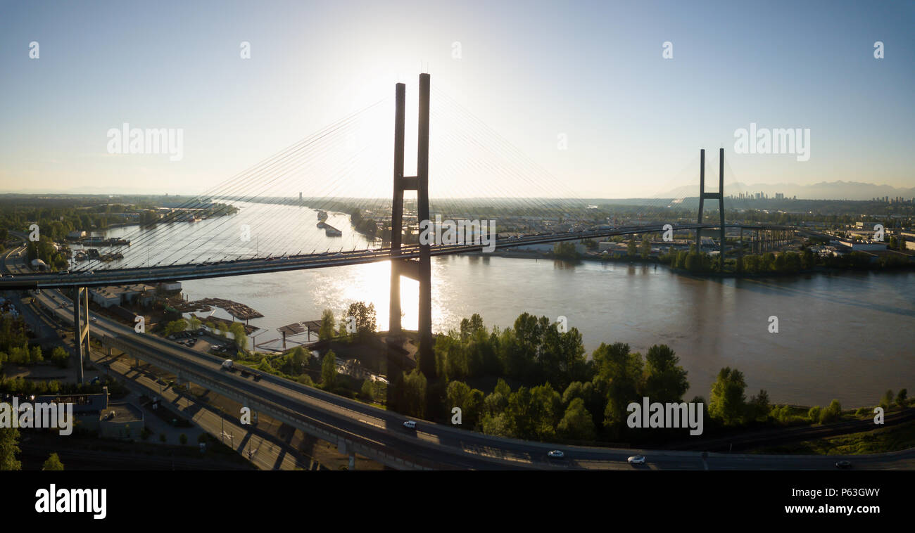 Aerial view of Alex Fraser Bridge during a vibrant sunny day. Taken in ...