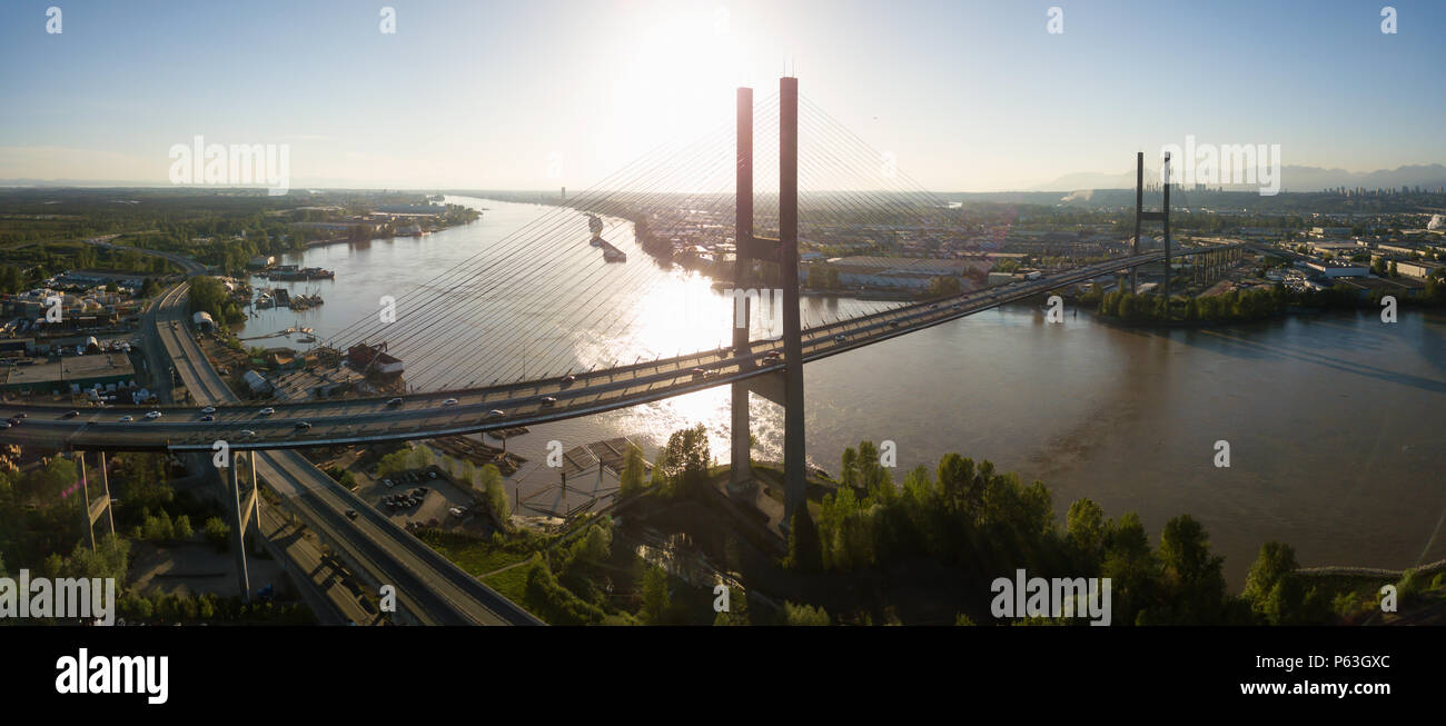 Aerial view of Alex Fraser Bridge during a vibrant sunny day. Taken in ...
