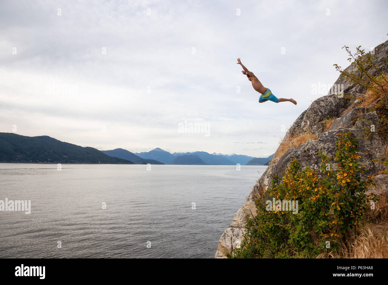 Man jumping from a rock hi-res stock photography and images - Alamy
