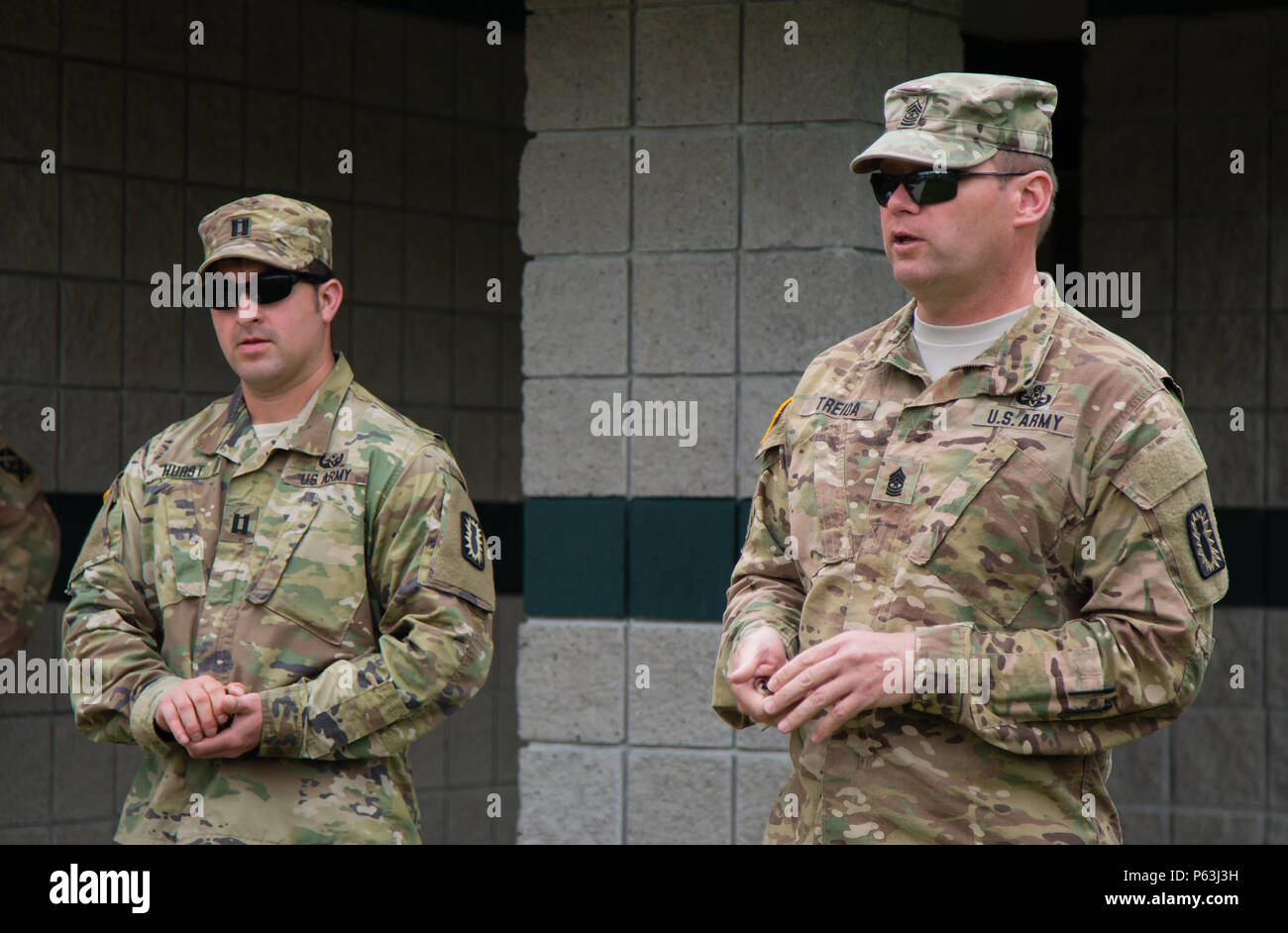 U.S. Army Sgt. Maj. John Treida (right), assigned to 52nd Ordnance ...