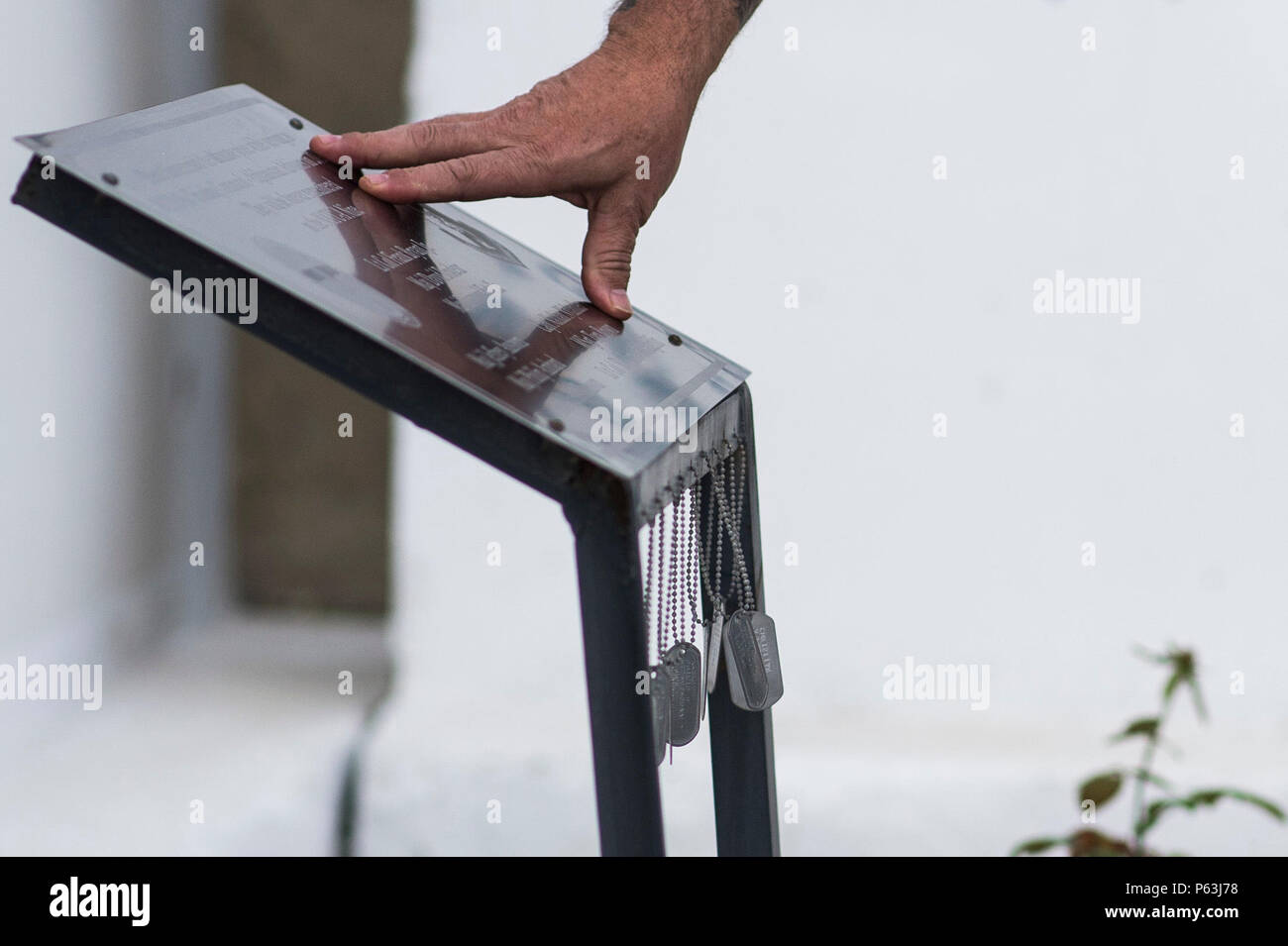 A coalition forces member pays tribute during the remembrance ceremony ...