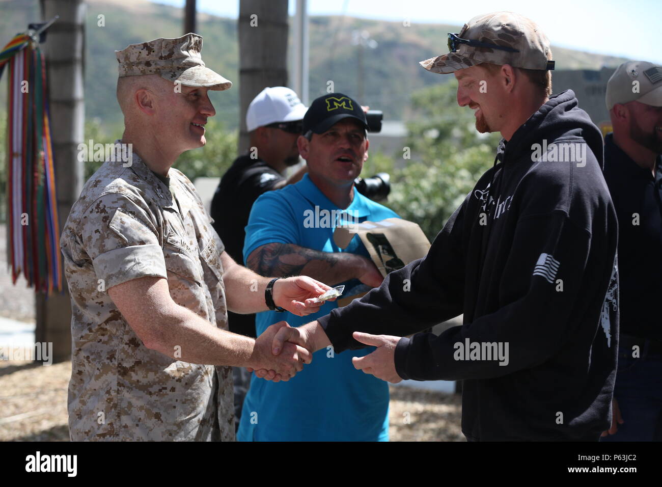 MARINE CORPS BASE CAMP PENDLETON, Calif. – Cpl. Ryan Provasi accepts a ...