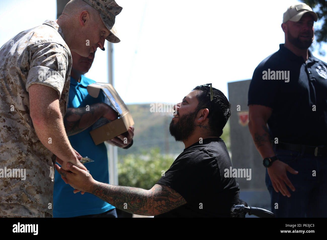 MARINE CORPS BASE CAMP PENDLETON, Calif. – Cpl. Juan Dominguez accepts ...