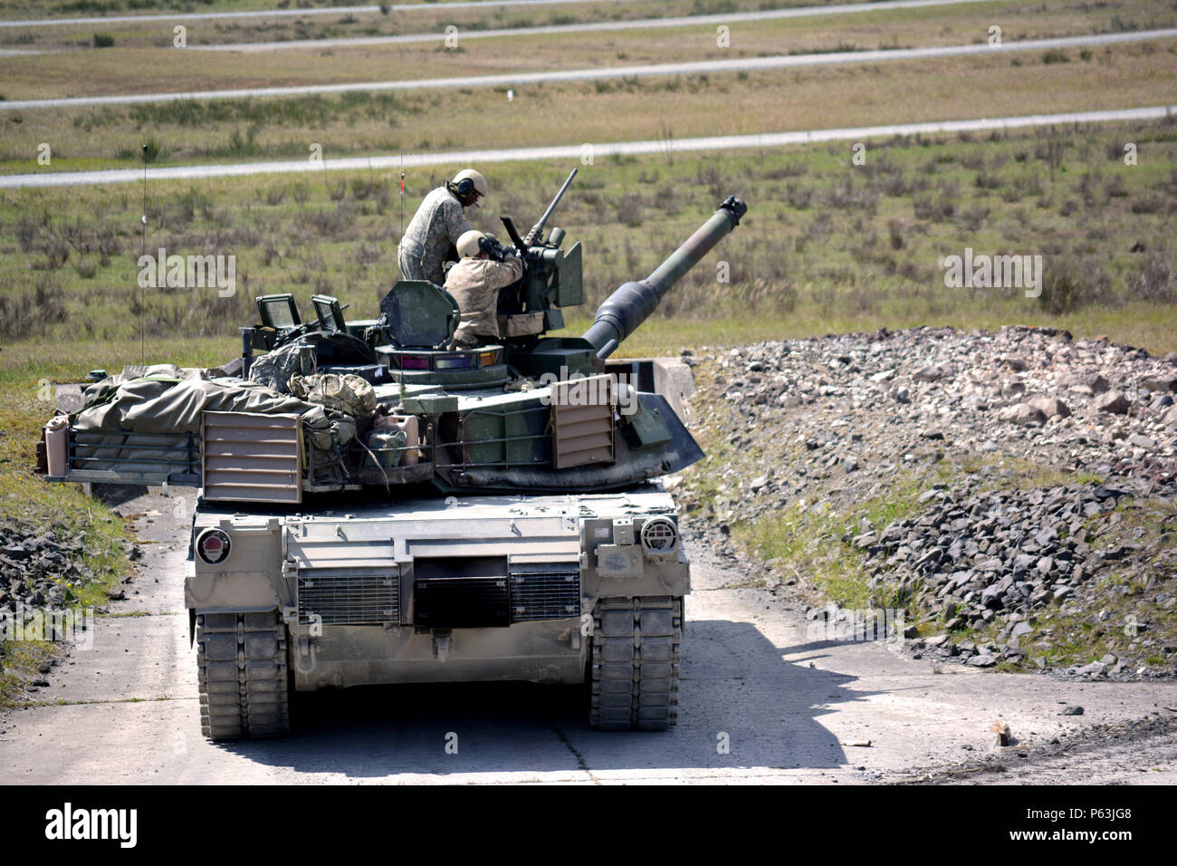 A tank crew from 2nd Battalion, 7th Infantry Regiment loads the M2 .50 ...