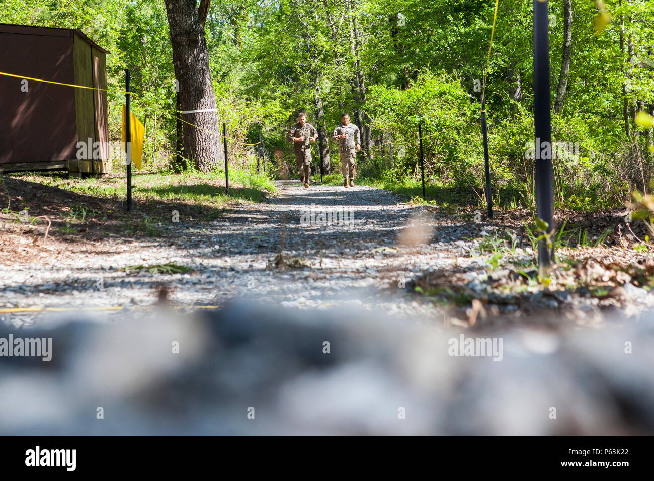 U.S. Army Rangers approach the finish line of the Darby Queen obstacle ...