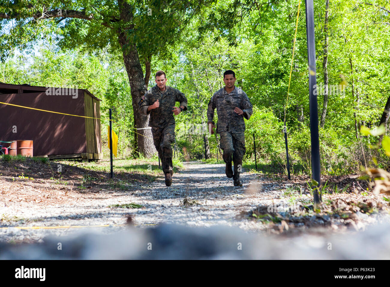 U.S. Army Rangers approach the finish line of the Darby Queen obstacle ...