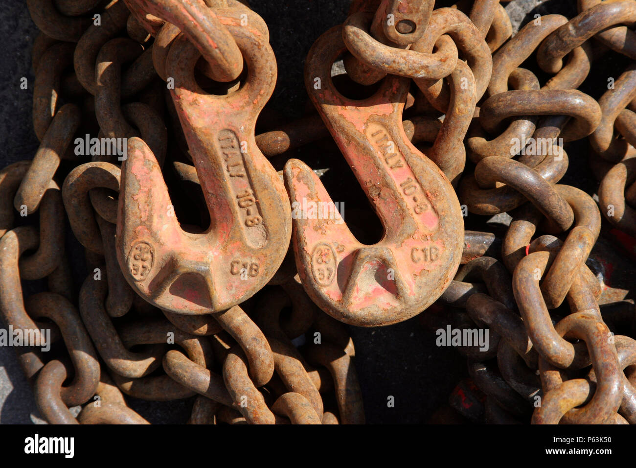 Two hooks and chain links used for lifting on construction site Stock ...