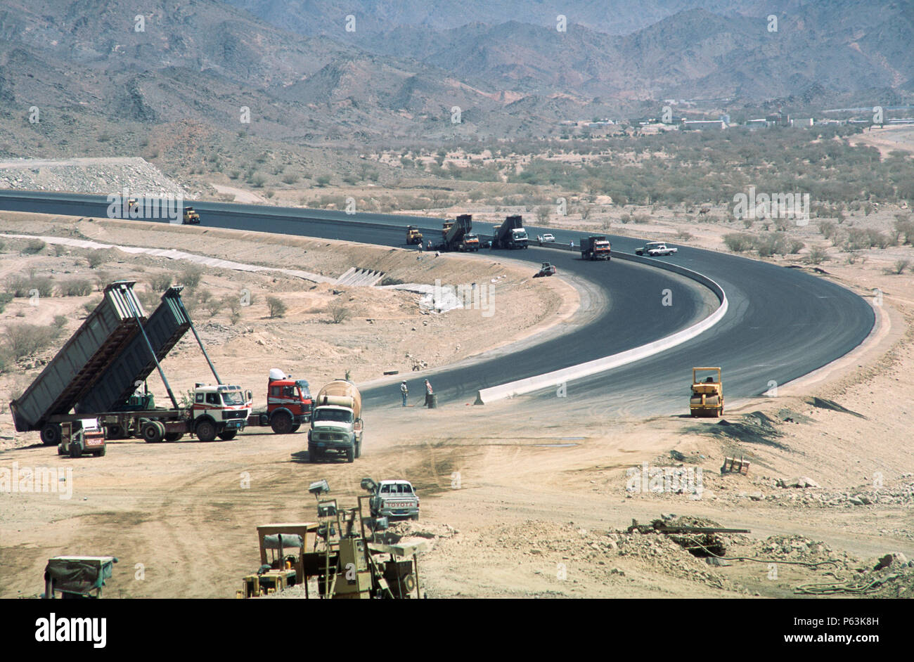 Rolling the asphalt for a section of the Medina-Jedda motorway in the ...