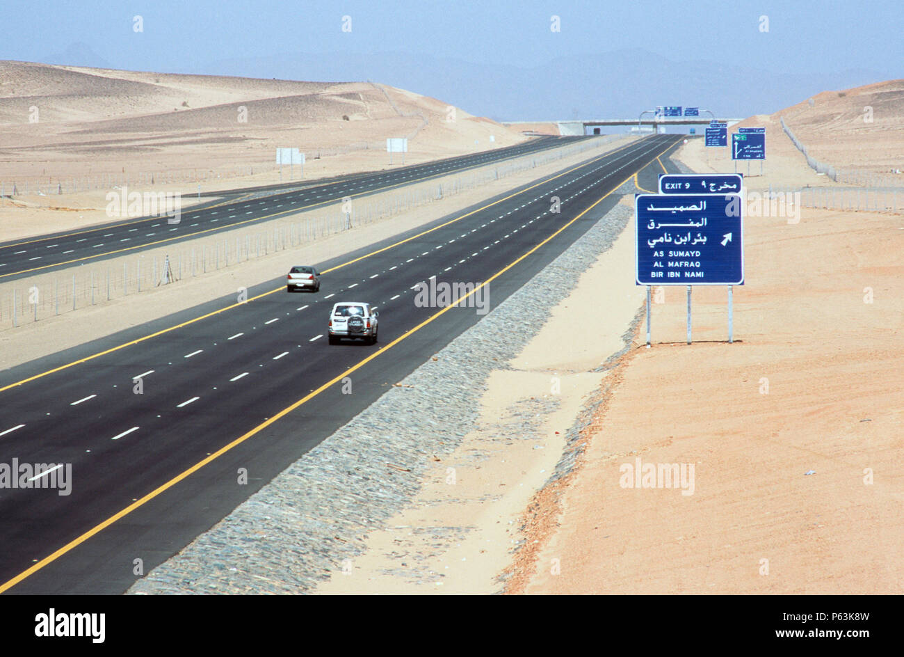 Long view - finished road in the Medina section with road signs, Saudi ...