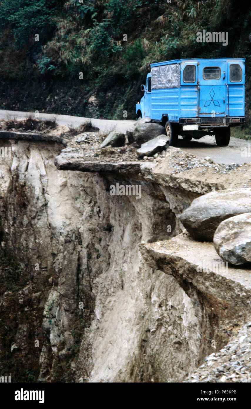 Heavily undercut road still in use in the mountain route northwards on ...