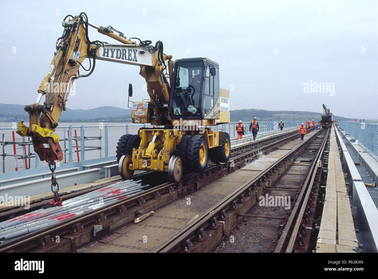 Lifting out old bridge sections on a railway crossing on the northern ...