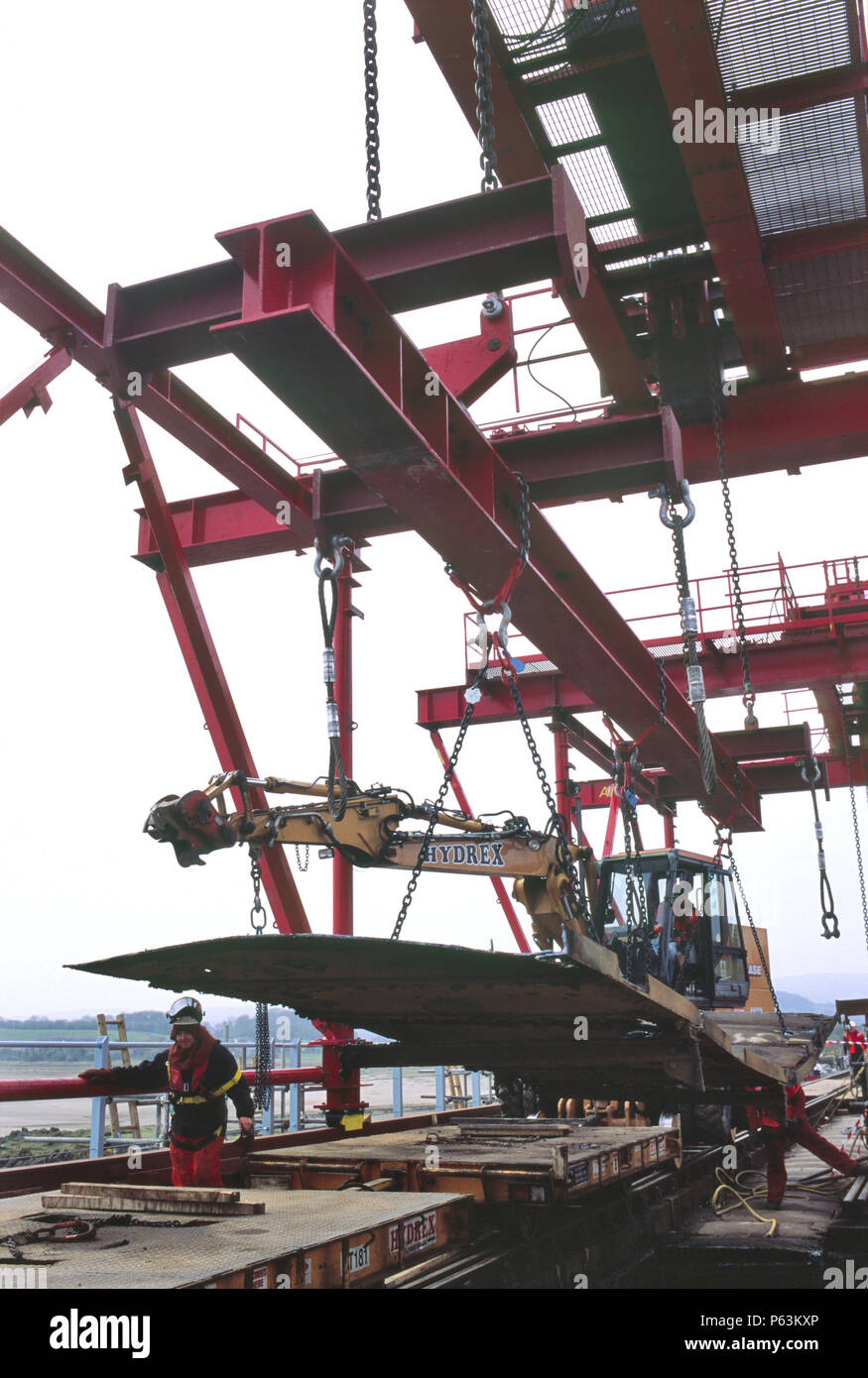 Checking work replacing old bridge sections on a railway crossing on ...
