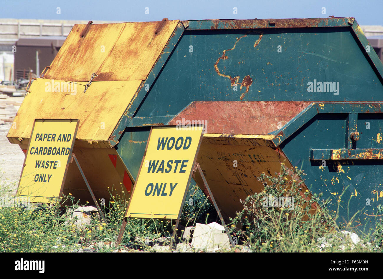 Waste skips on site with sorted types of waste Stock Photo - Alamy
