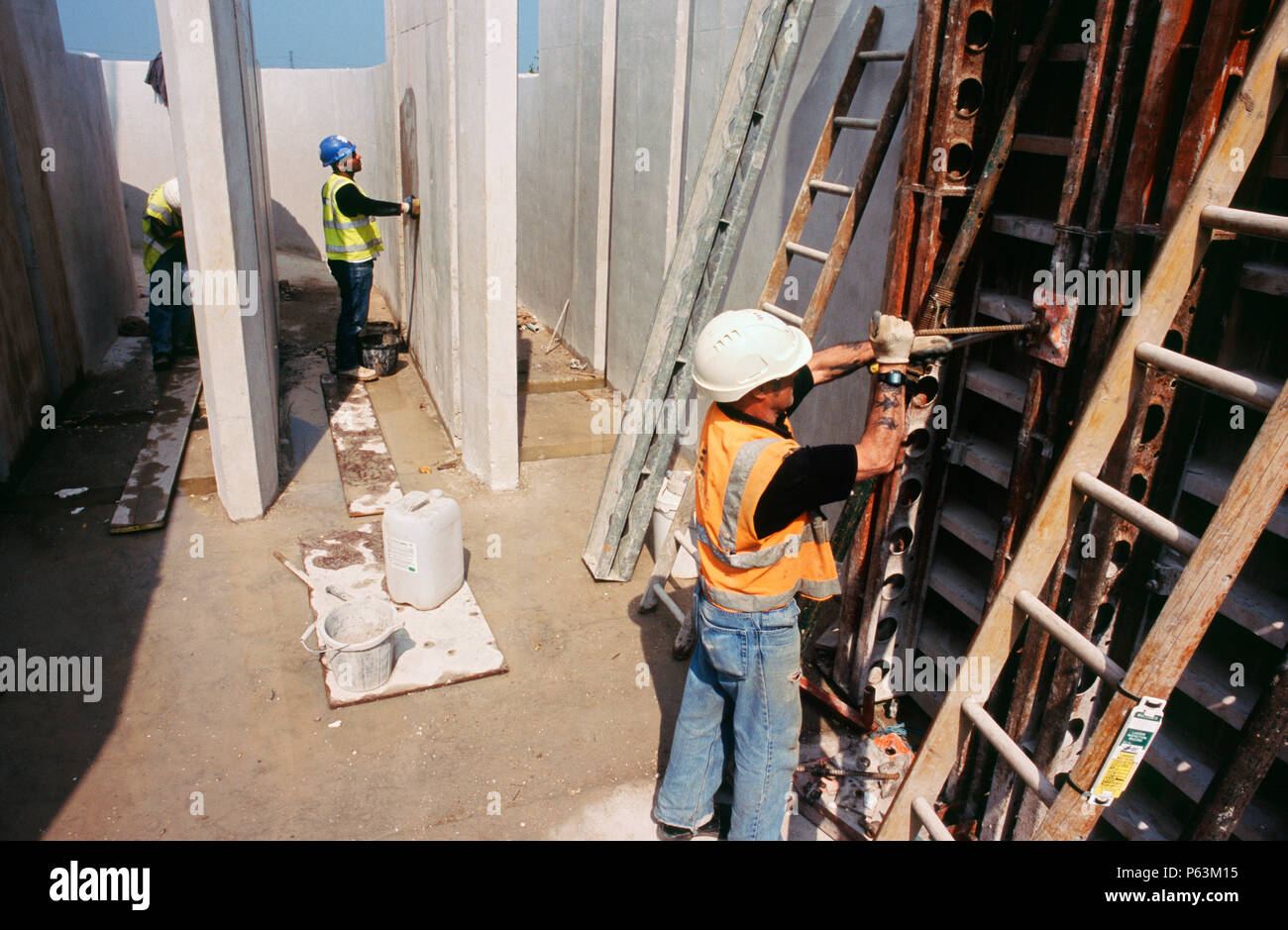 Finishing work on concrete flow channels at the wastewater treatment ...