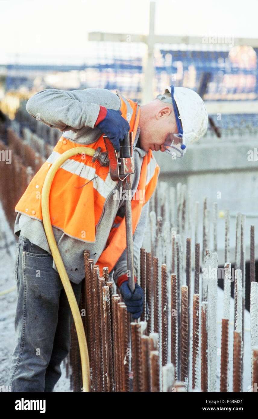 Scabbling concrete for the parapet pour on one of four bridges under ...