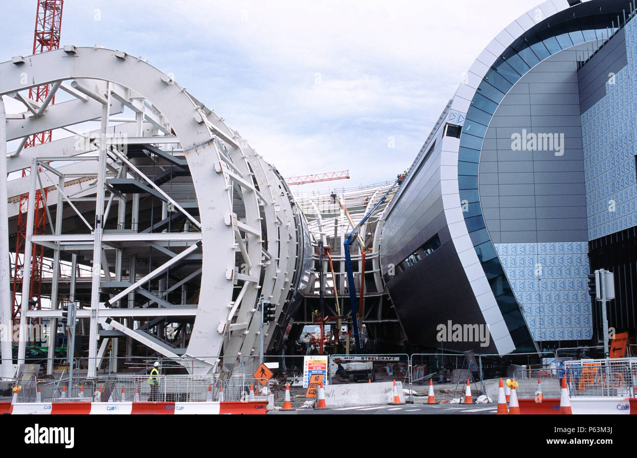 Curved steel frame is worked on from a variety of platformsw for the ...