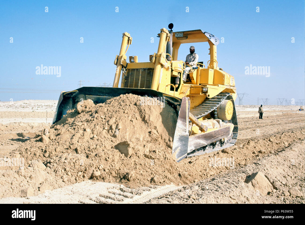 Levelling desert ground for road base on the Dubai back road project ...