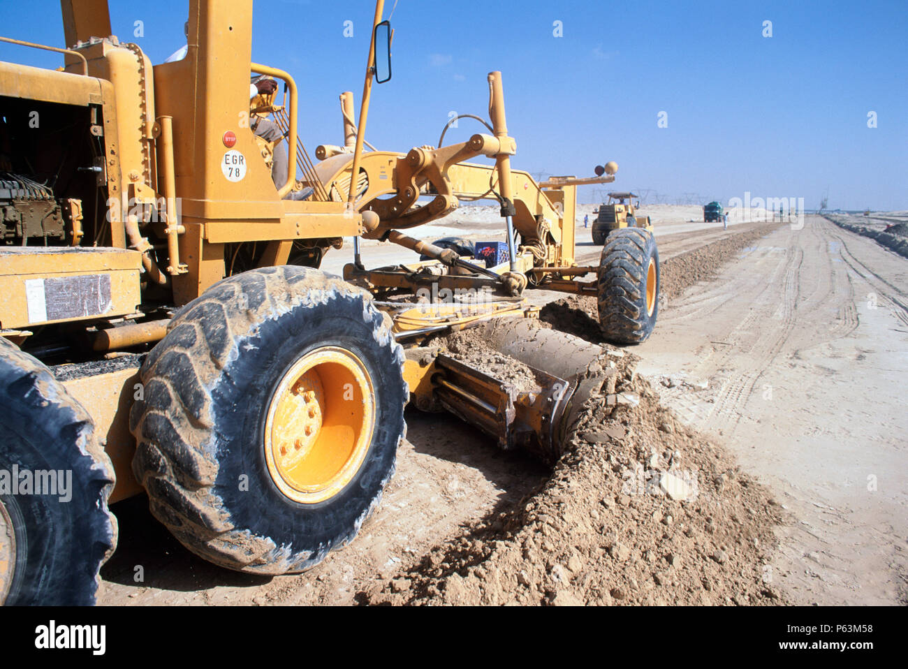 Levelling desert sand material for the road base. Dubai, UAE Stock ...
