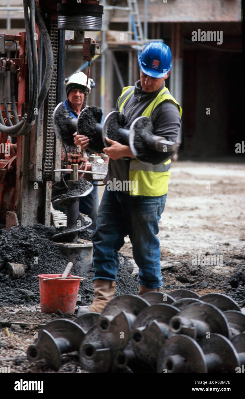 Drill string augur sections piled up as the mini piler withdraws and ...