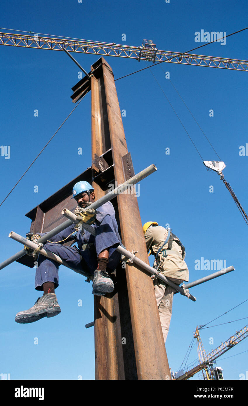 Fixing steel columns on the new Finance District Gateway building in ...