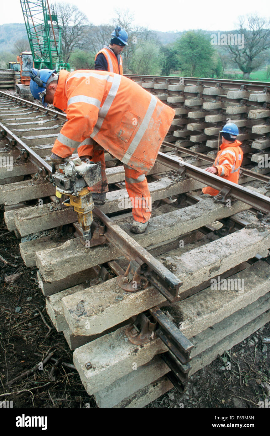 Working on track sections for replacing a washed out railway line in ...