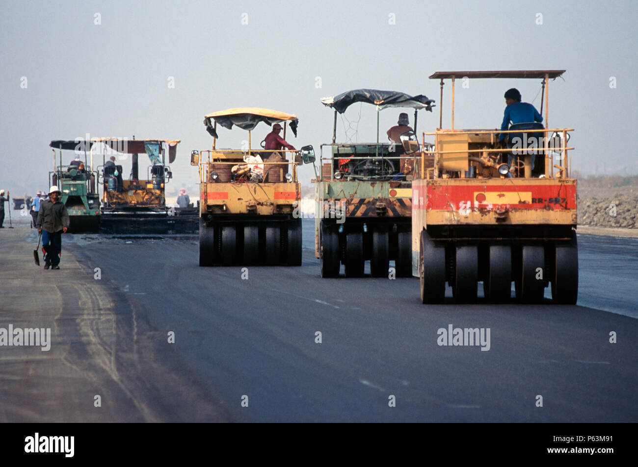 Tyred compactors used to achieve smooth finish on runway asphalt at ...