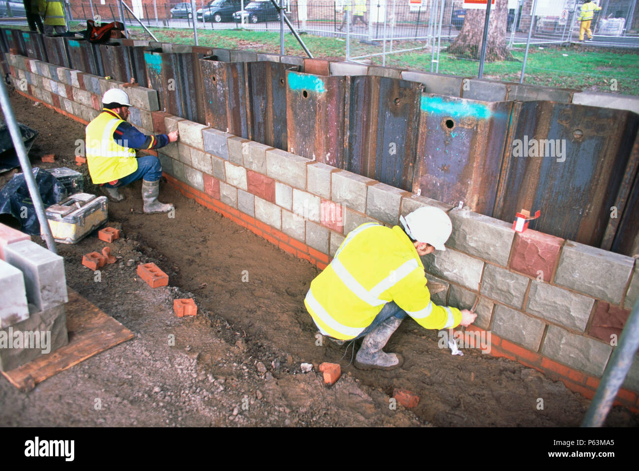 Stone facing work for the sheet pile section of the flood wall ...