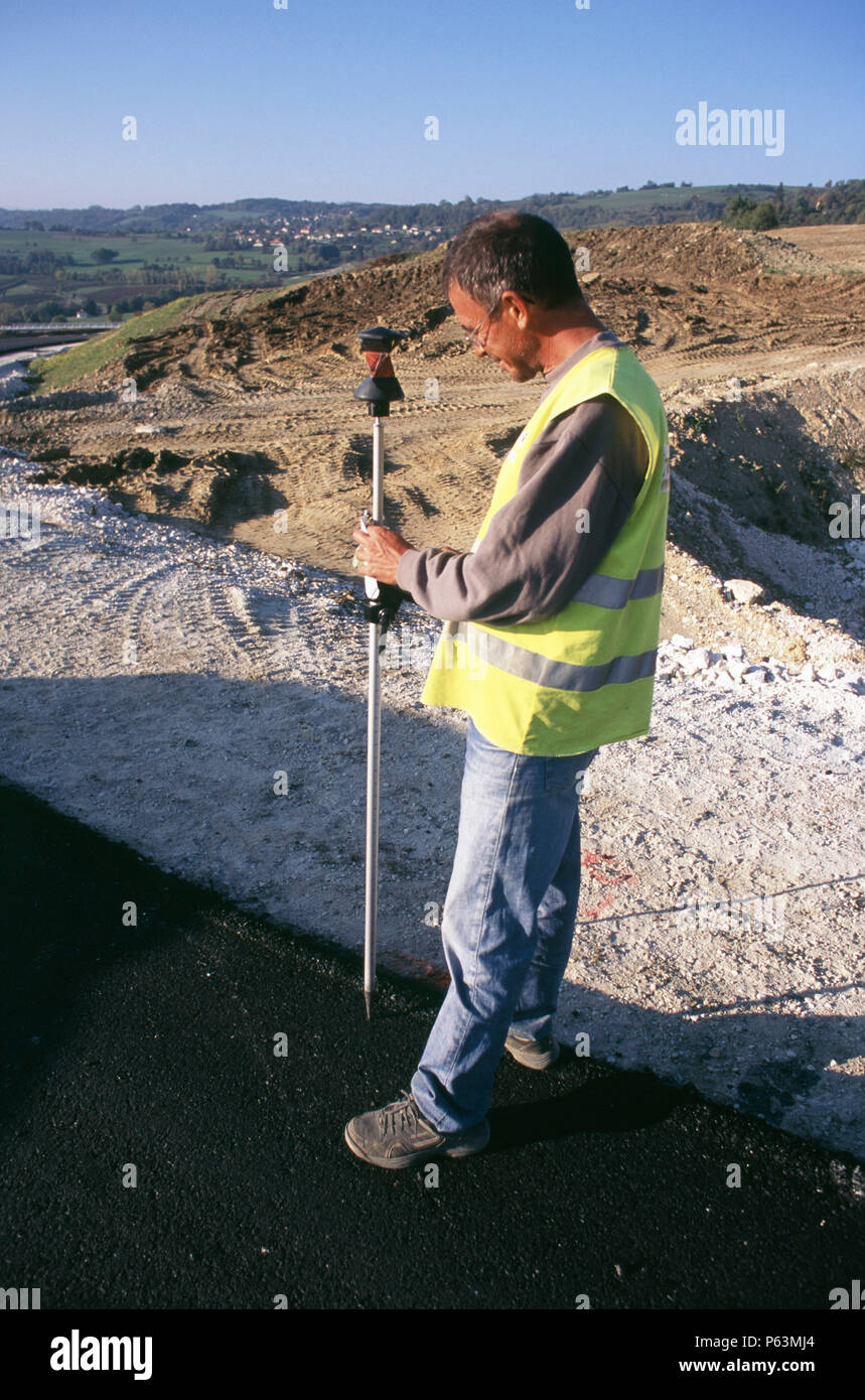 Surveyor using a GPS during construction of French motorway Stock Photo ...