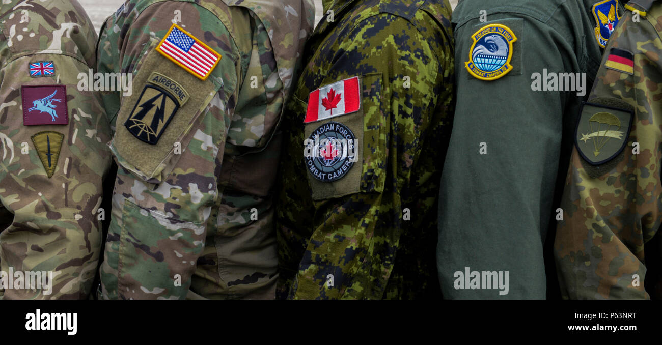 Military Combat Camera members, including British, U.S. Army, Canadian ...