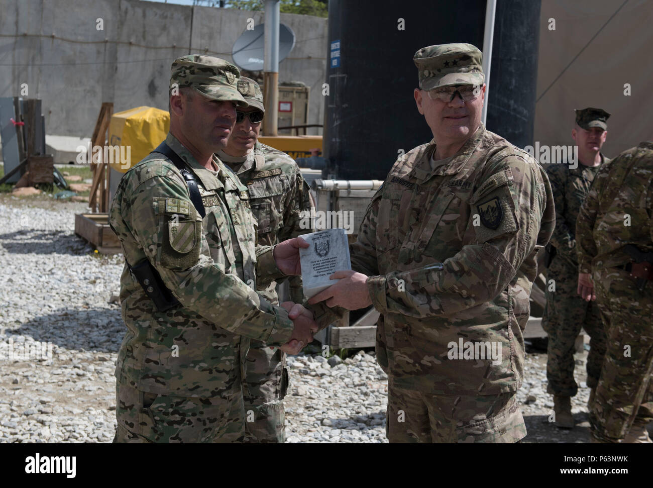 Maj. Gen. Jeffrey Bannister, Bagram Airfield Commander, presents a ...