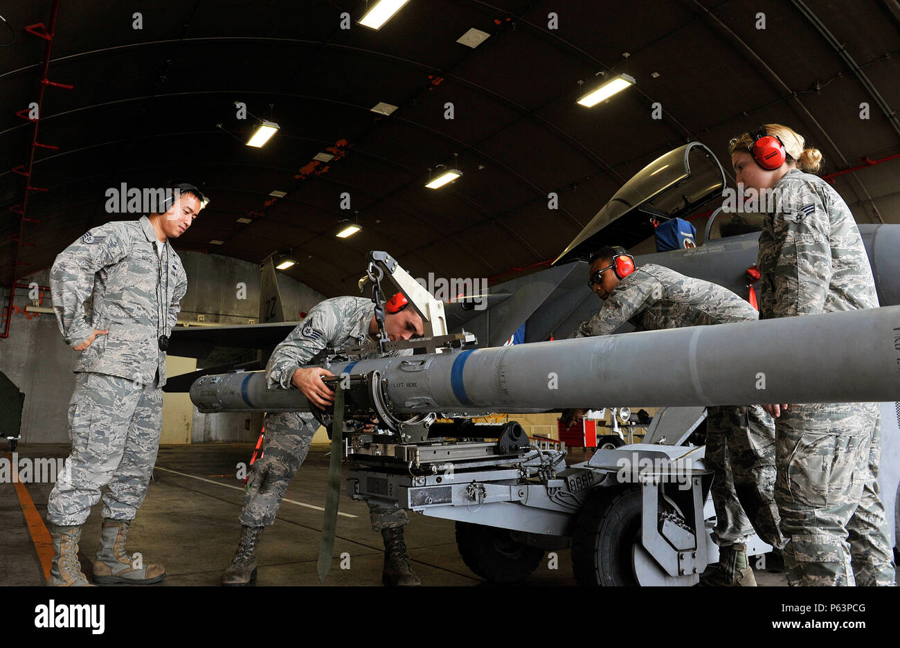 Weapons load crew members from the 67th Aircraft Maintenance Unit ...