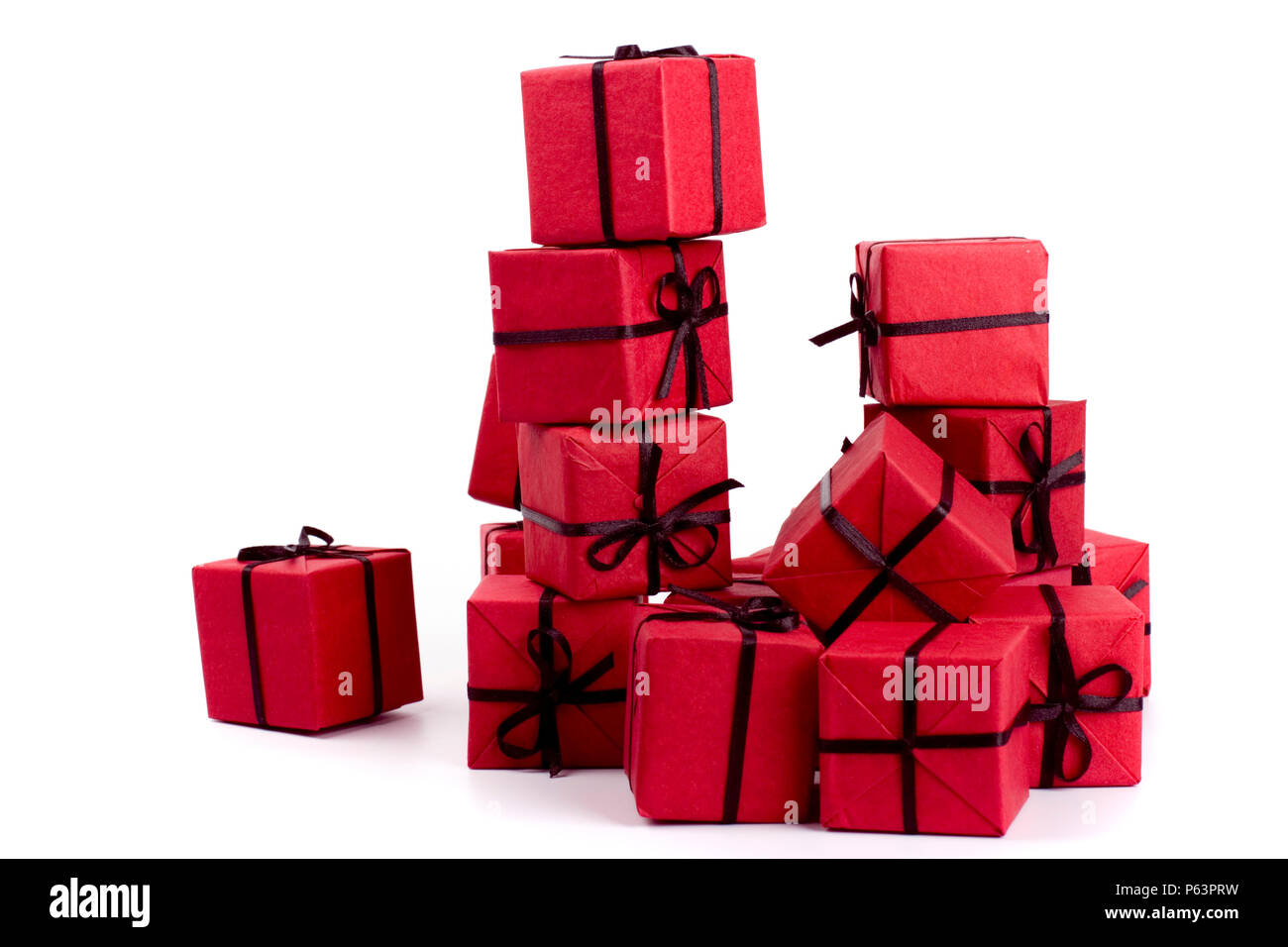 stack of red gift boxes on white background Stock Photo - Alamy