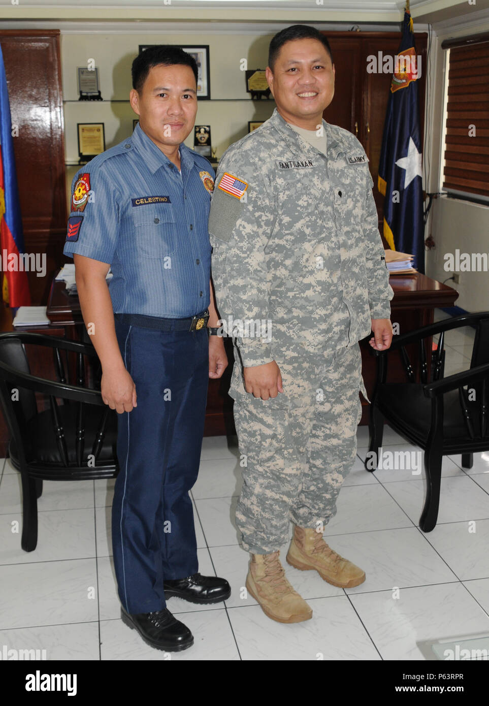 MANILA, Philippines. – Officer Christian Celestino (left), a police ...