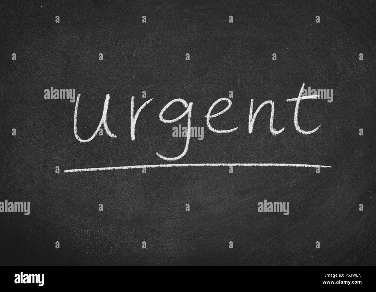 urgent concept word on a blackboard background Stock Photo - Alamy