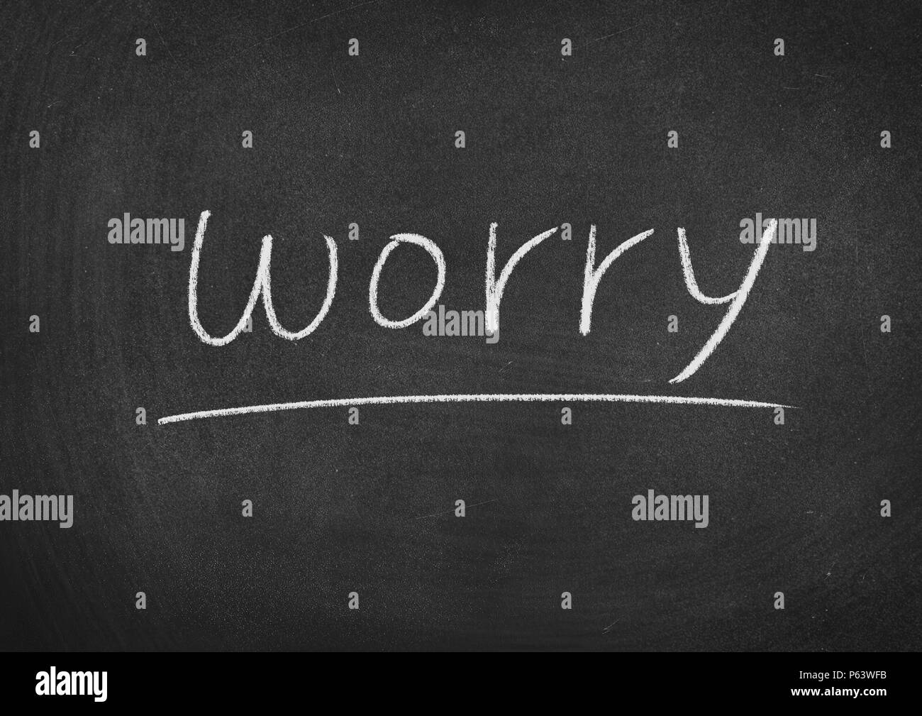 worry concept word on a blackboard background Stock Photo - Alamy