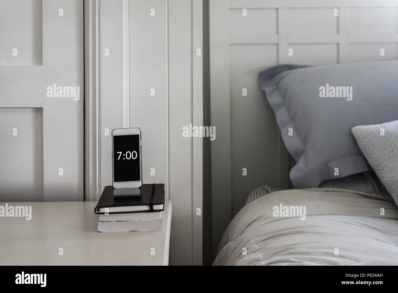 Mobile phone beside bed hi-res stock photography and images - Alamy