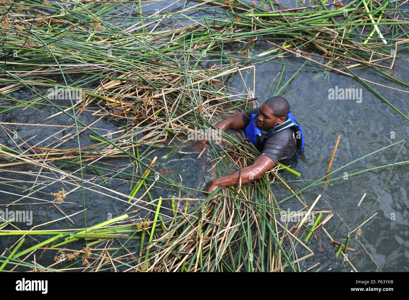A U.S. service member volunteering with the Single Marine Program (SMP ...