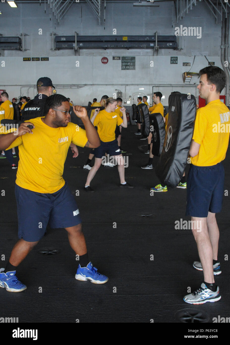 160419-N-JY875-087 ATLANTIC OCEAN (April 19, 2016) Sailors strike pads ...