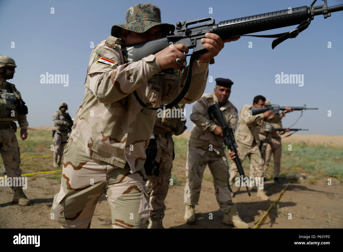 Iraqi soldiers with the 35th Iraqi Army Brigade practice reflexive fire ...