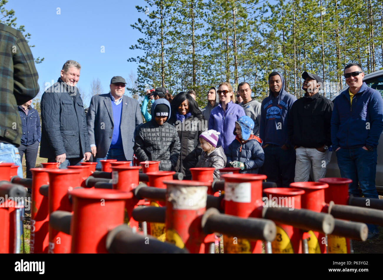 A group of volunteers await instructions on how and where to plant ...