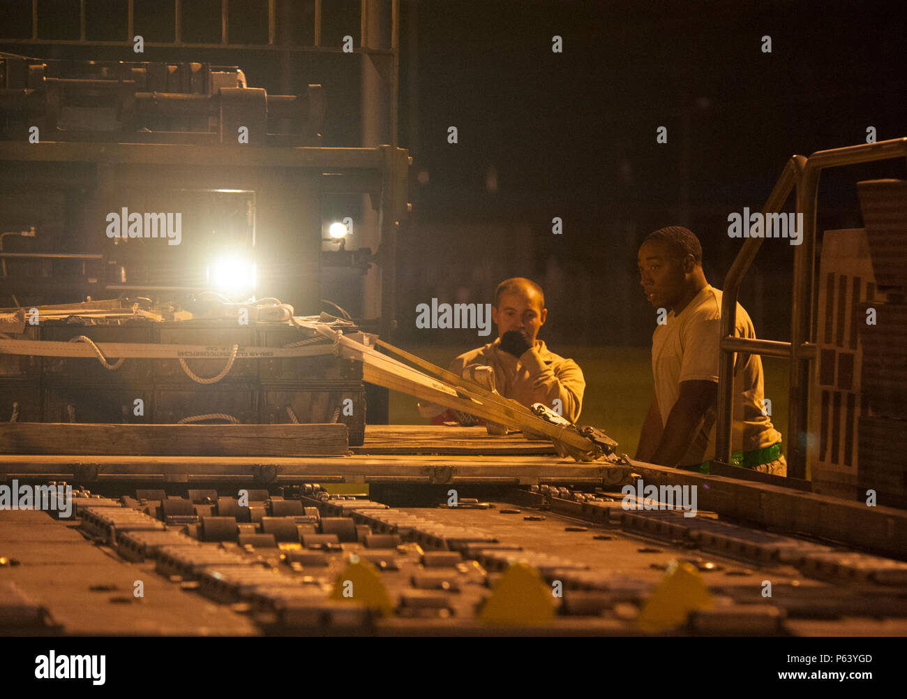 Staff Sgt. Lexington Ellis speaks with Airman 1st Class Kyle Mathews ...